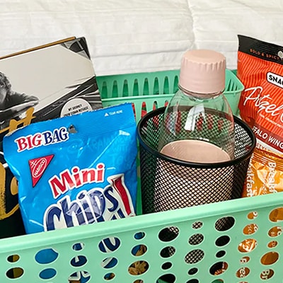 Blog idea: plastic mint green basket containing snacks, a water bottle ...