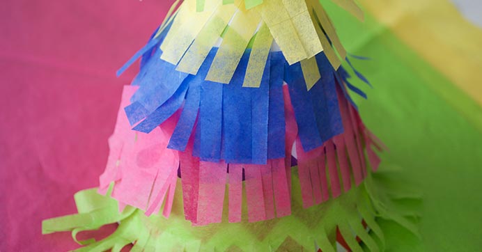 Wrap the tissue paper up the party hat