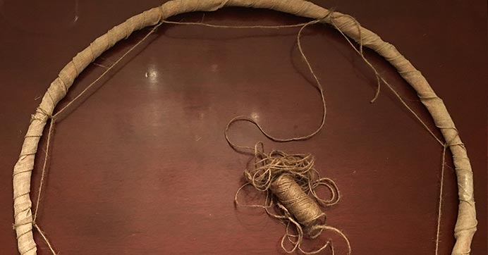 Wrap twine around the hoop