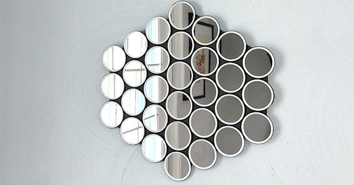 A mirror created out of a lot of small mirrors.