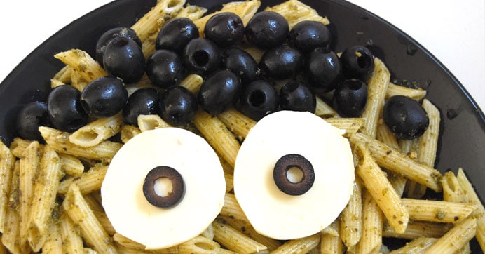 Noodles, black olives and round pieces of mozzarella.