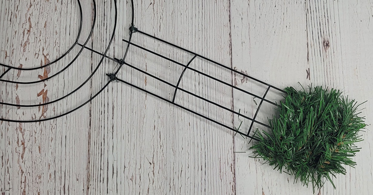 The letter Y made out of a wire wreath form with garland wrapped up the ...