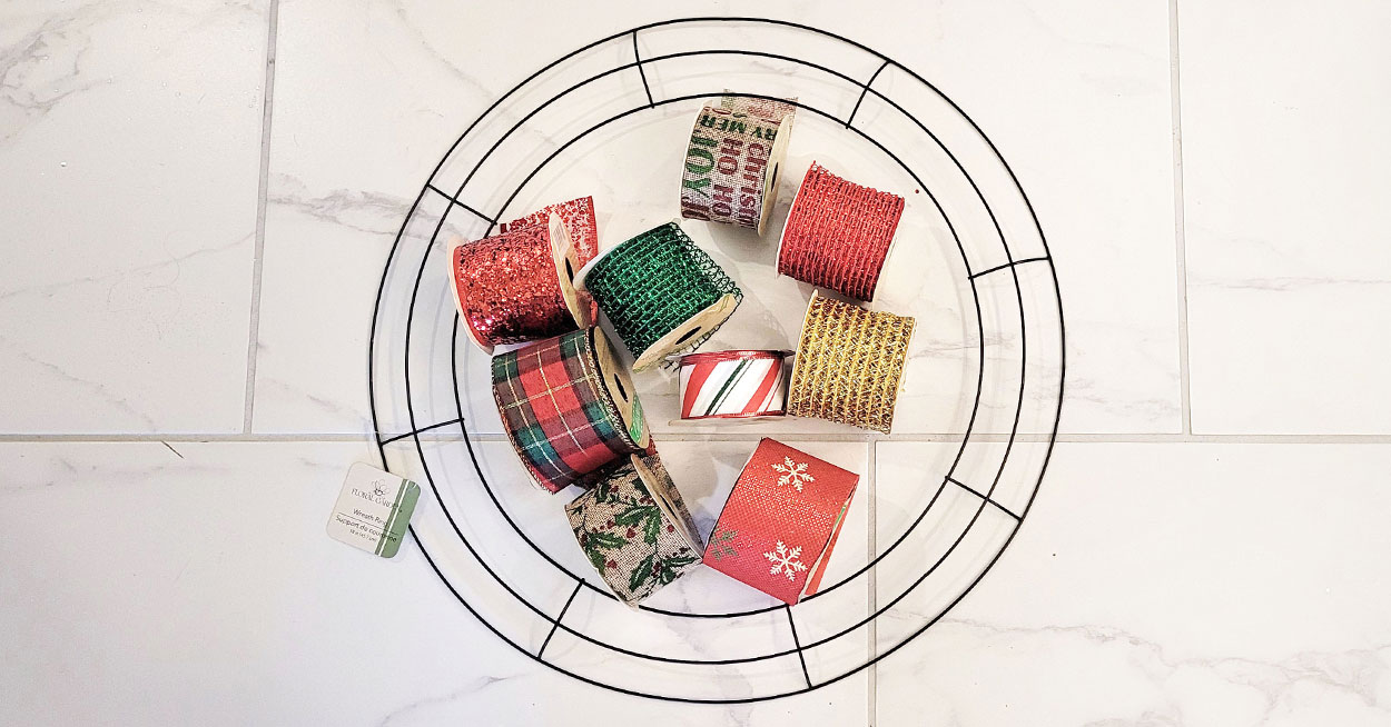 rolls of ribbon and a wire wreath form