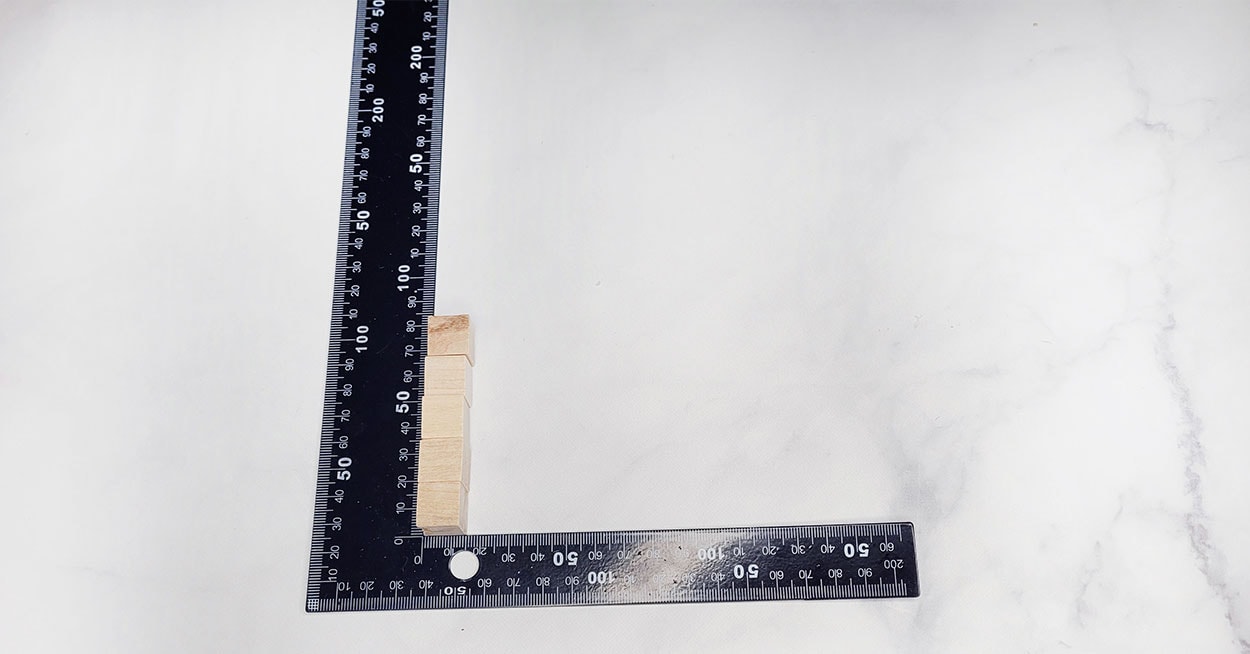 An angle ruler and wooden cubes.