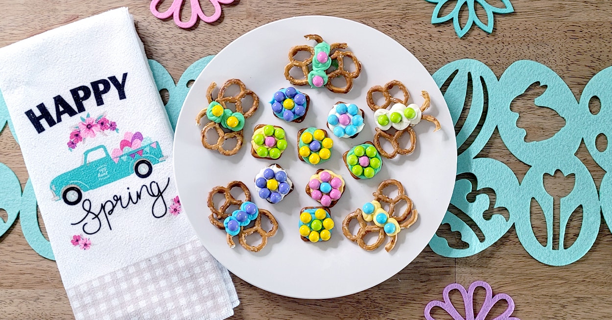 Alt. Text: A white plate filled with pretzels shaped like butterflies ...