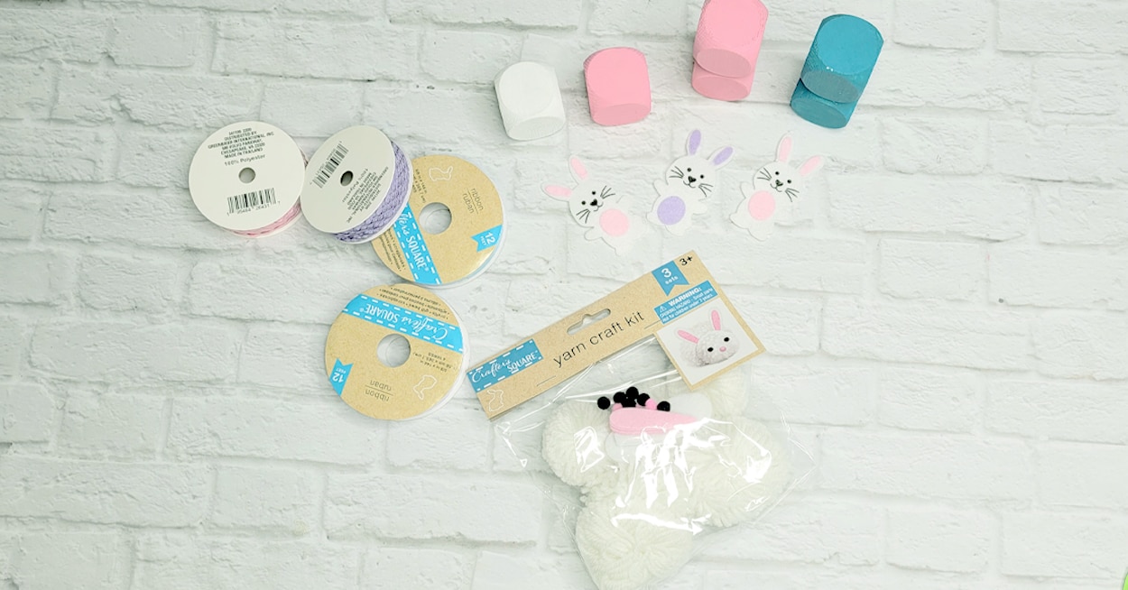 Painted wooden cubes, spools of ribbon, a bunny craft kit.