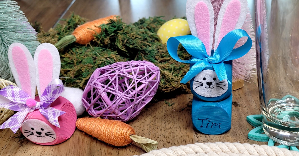 A plate and a glass, wooden bunny place marker, a small jute carrot ...