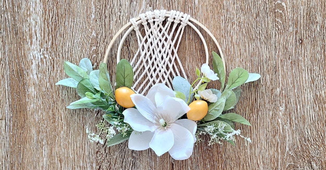 Two bamboo hoops with macrame twine and a magnolia flower and lemons on it.