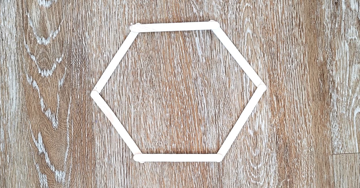 A hexagon made from popsicle sticks.