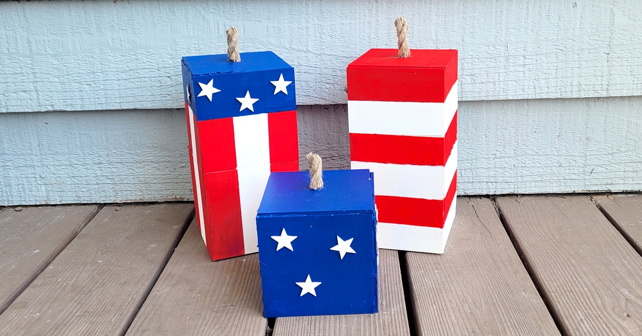 Three decorative tabletop pieces made of wooden blocks, painted red ...