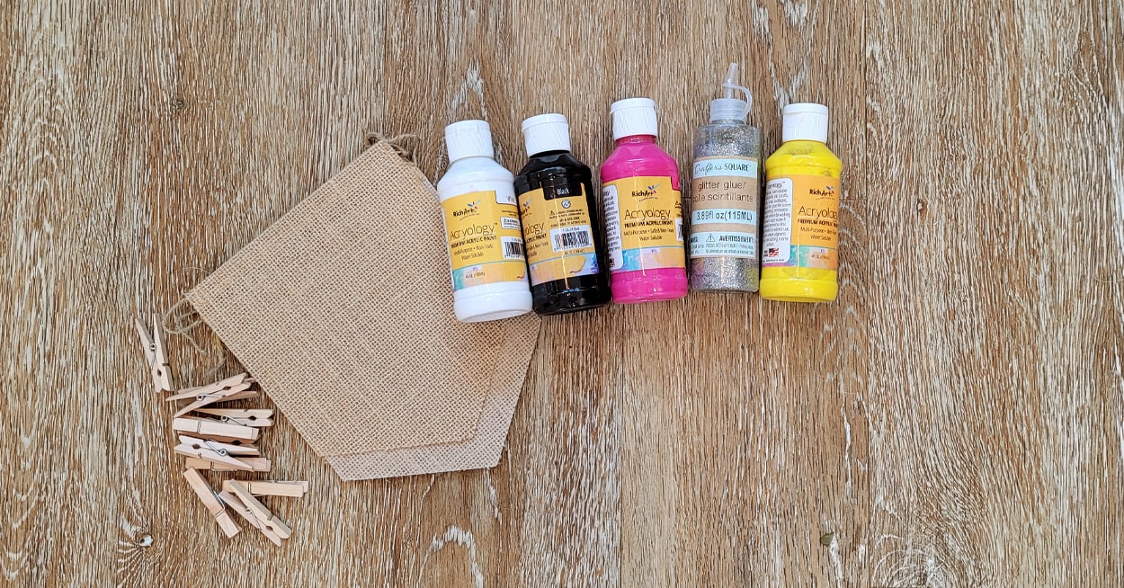 Small clothespins, a burlap banner, bottles of pink, white, yellow, and ...