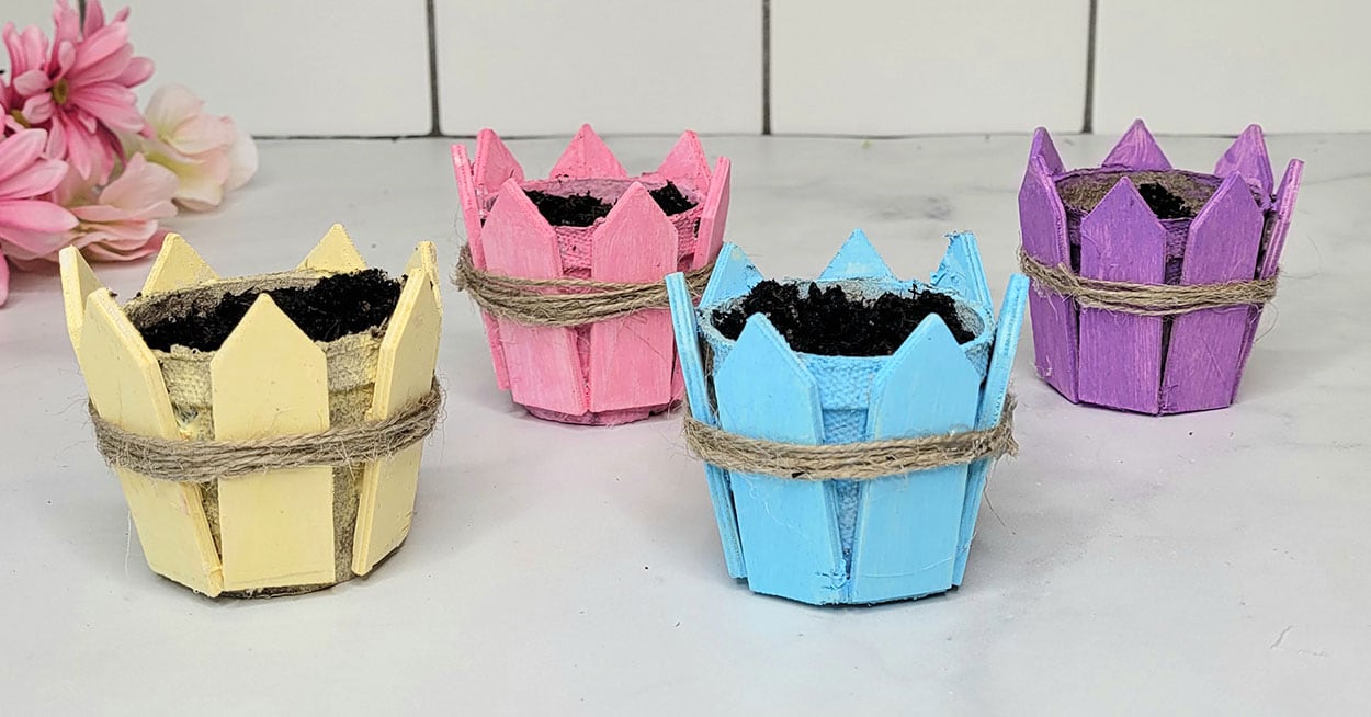 4 small DIY picket fence planters in yellow, pink, blue, and purple ...