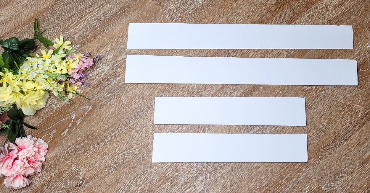 Flowers and 4 pieces of white foam board.